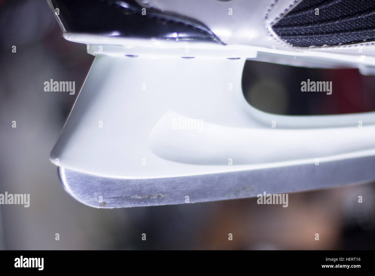 Ice skates in skate store shop window on display on sale for skating on ...