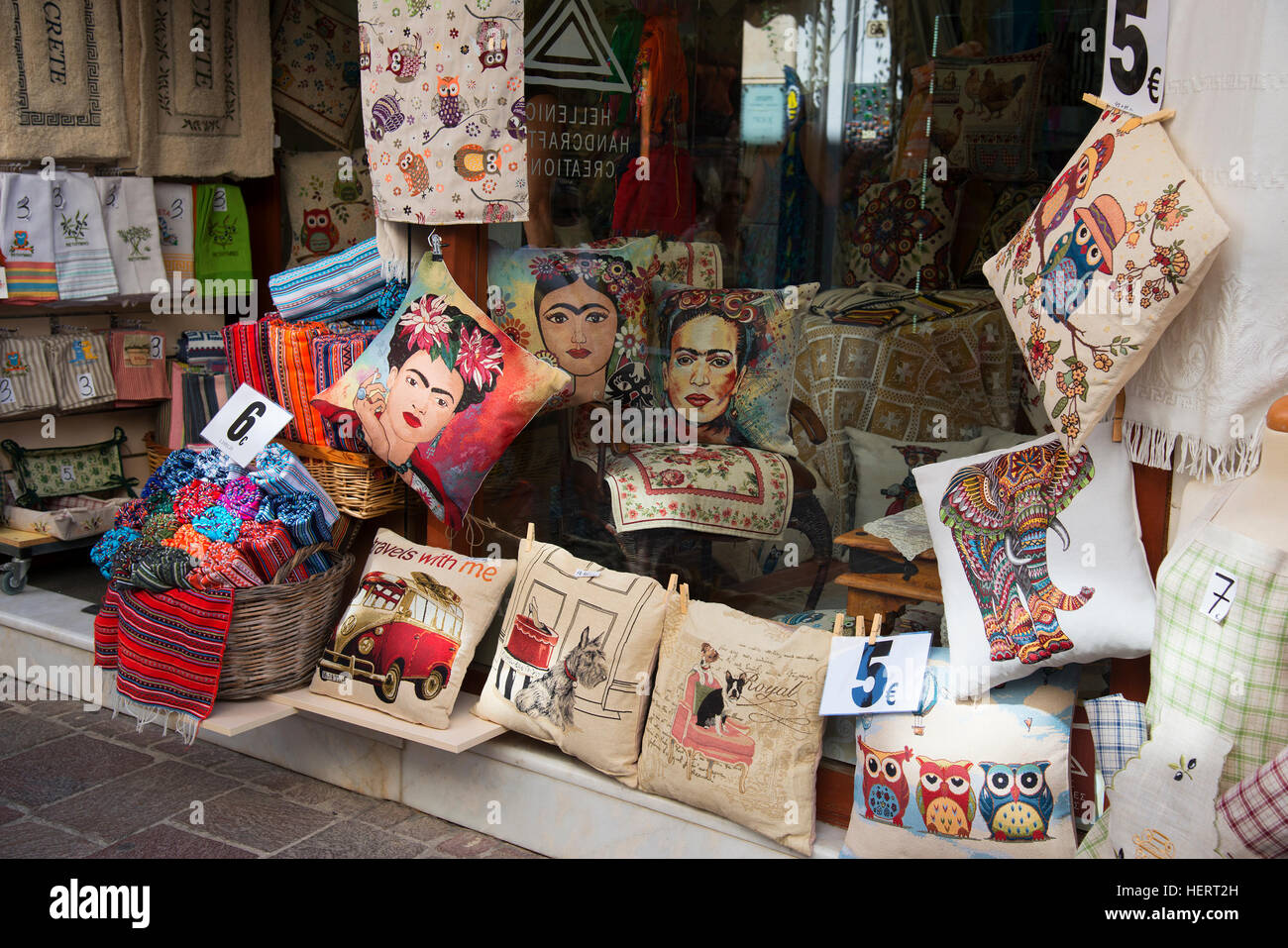 shop window with cushions decorated with pictures, cartoon figures and ...