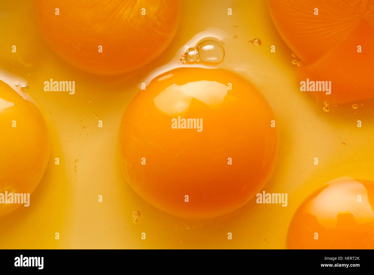 Egg yolk close up background Stock Photo - Alamy
