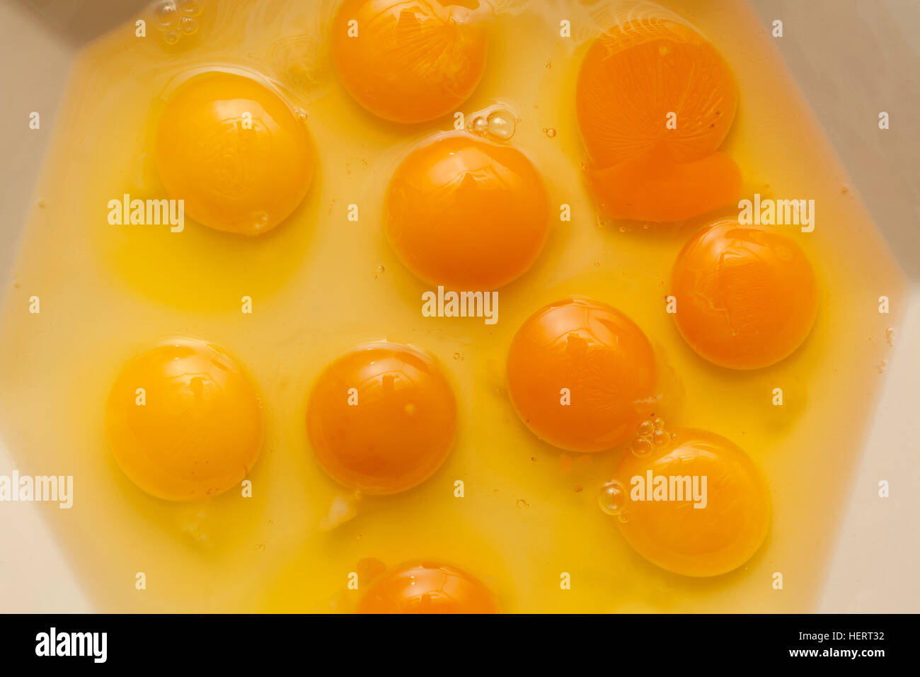 Egg yolk close up background Stock Photo - Alamy