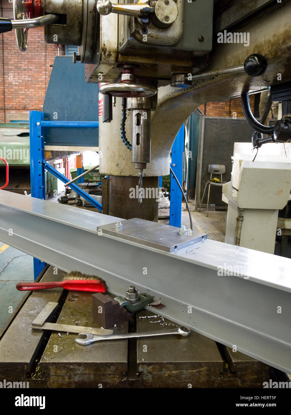 heavy engineering workshop drilling large steel beam Stock Photo - Alamy
