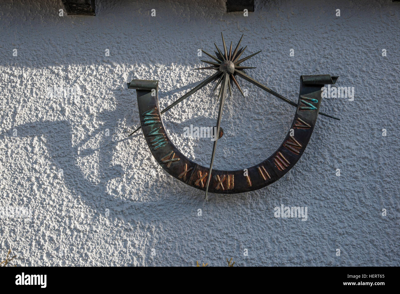 Sundial on the side of a house Stock Photo - Alamy