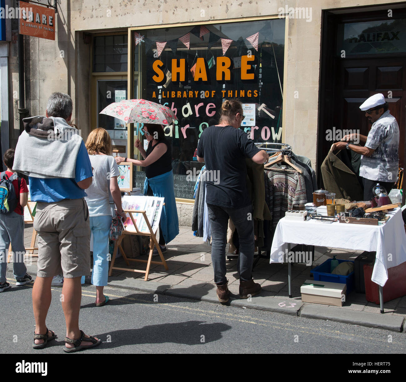 People shopping at a stall at Frome market Stock Photo - Alamy