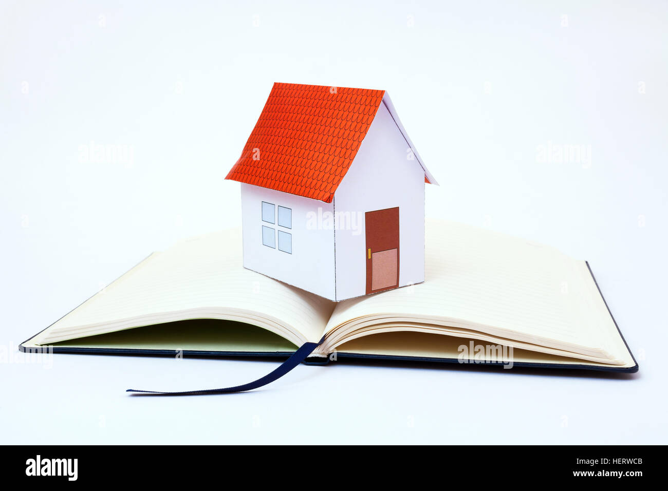 Requirements of the house. Paper house on memorandum block Stock Photo ...