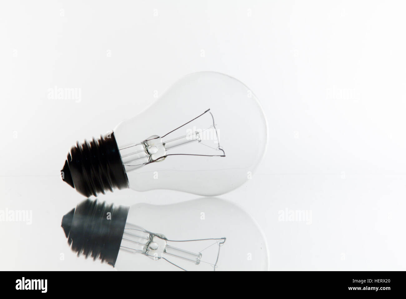 A very pure light bulb on white Stock Photo - Alamy