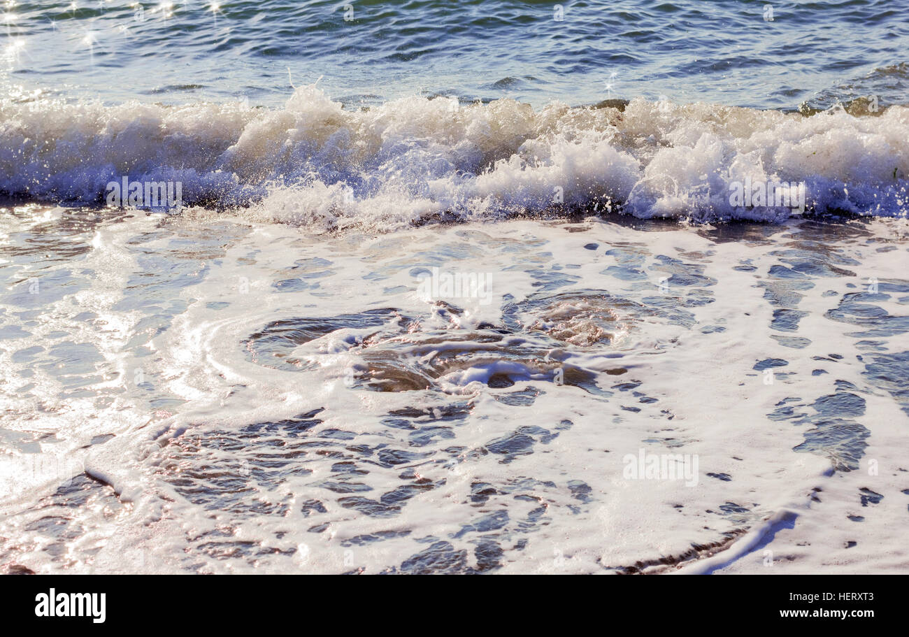 Surf on sea beach at summer sunny weather Stock Photo - Alamy