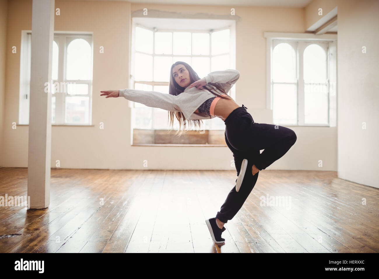 Pretty woman practising hip hop dance in studio Stock Photo - Alamy