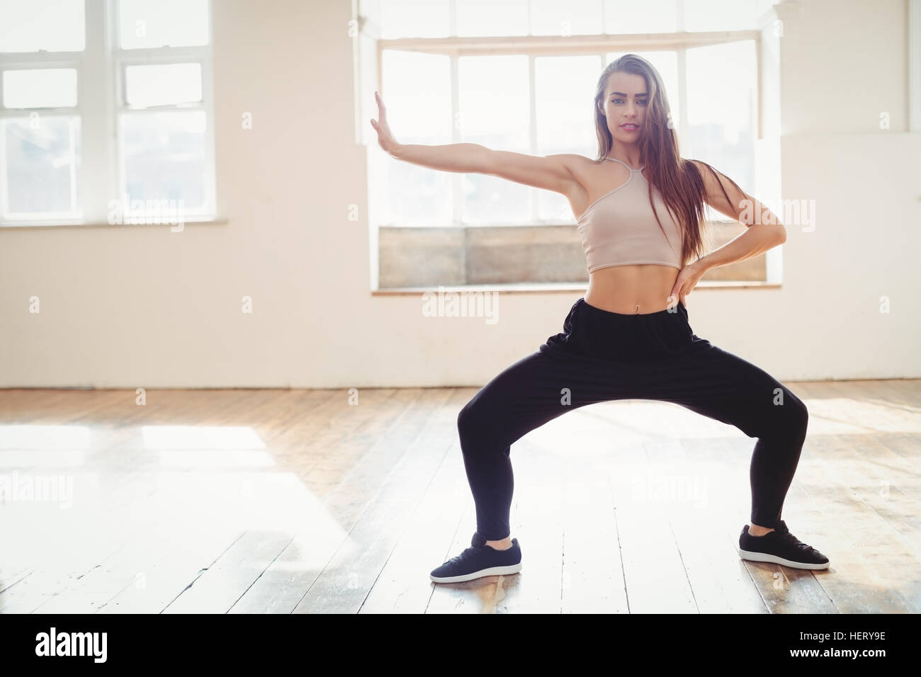 Pretty woman practising hip hop dance in studio Stock Photo - Alamy