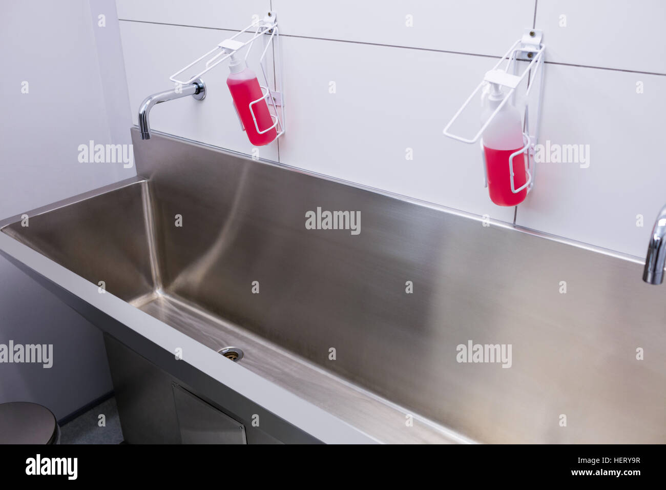Close-up of sink with hand liquid in hospital Stock Photo - Alamy
