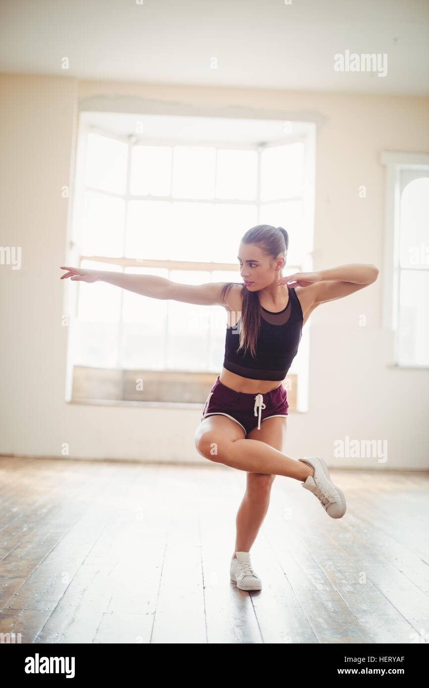 Pretty woman practising hip hop dance in studio Stock Photo - Alamy