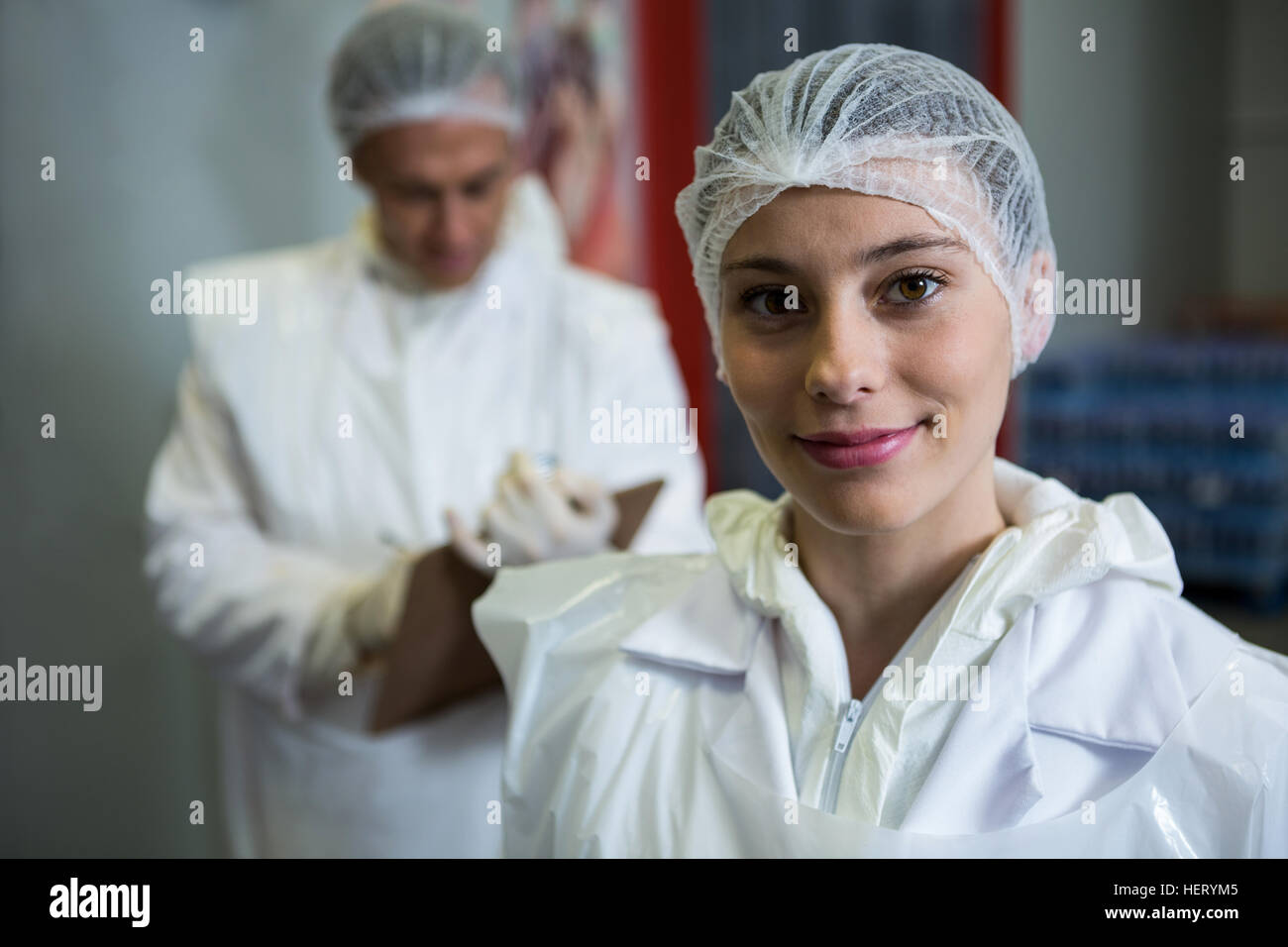 Portrait of female butcher smiling at meat factory Stock Photo - Alamy
