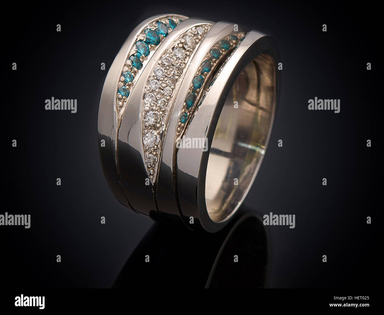silver ring with gemstone isolated on black background Stock Photo - Alamy