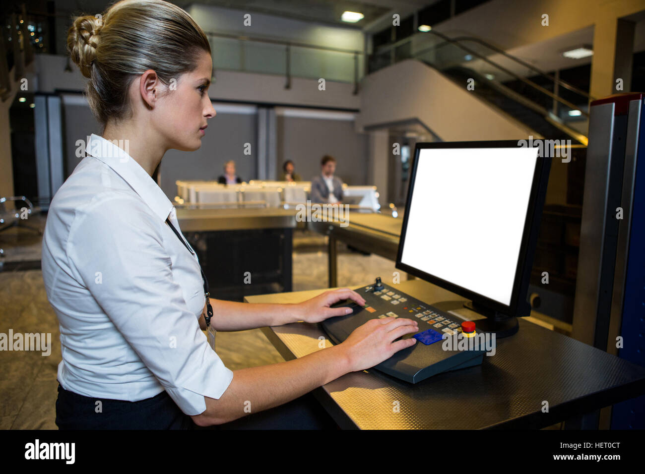 Female staff working on security desk in the airport terminal Stock ...