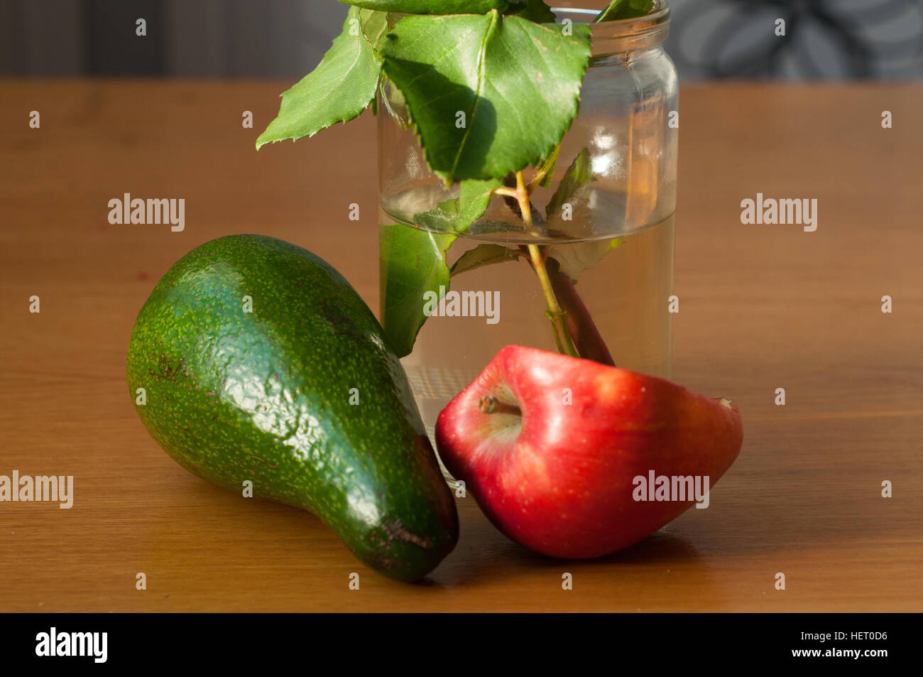 An avocado and a piece of apple Stock Photo - Alamy