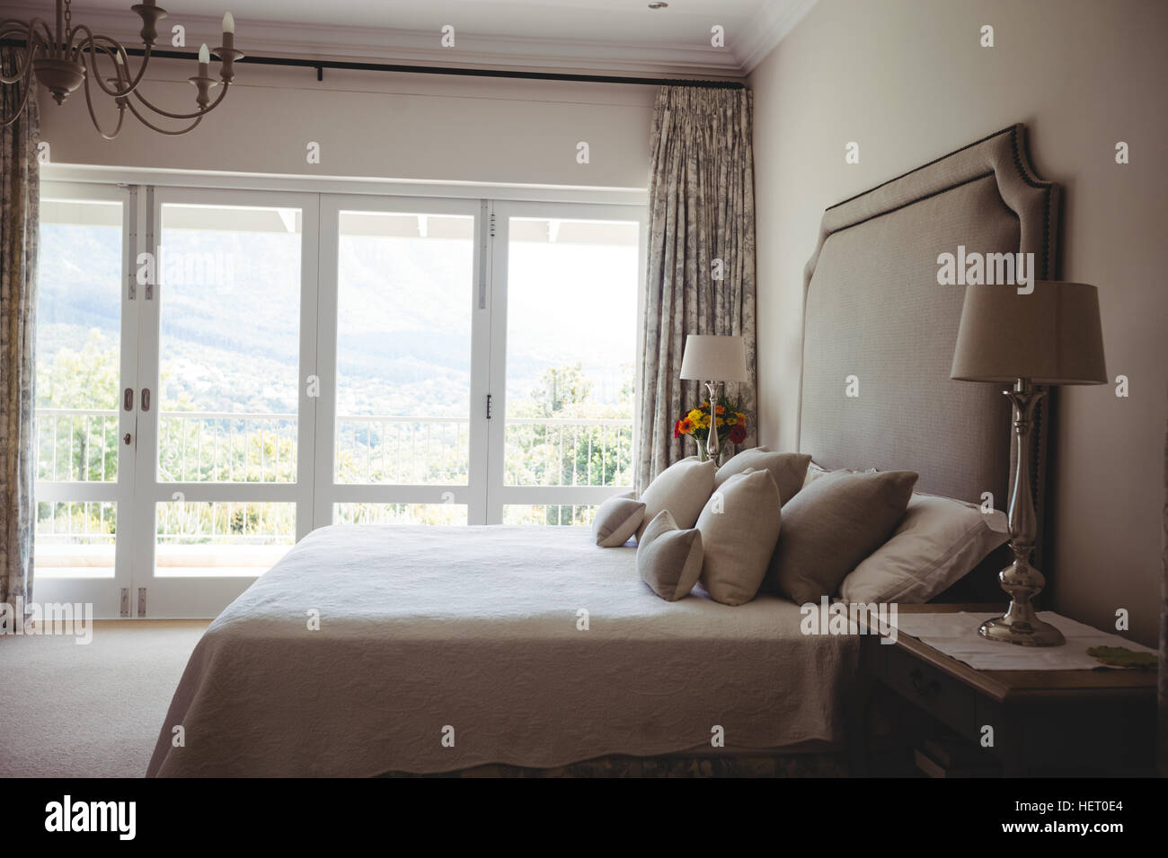 Empty bed in bedroom at home Stock Photo - Alamy