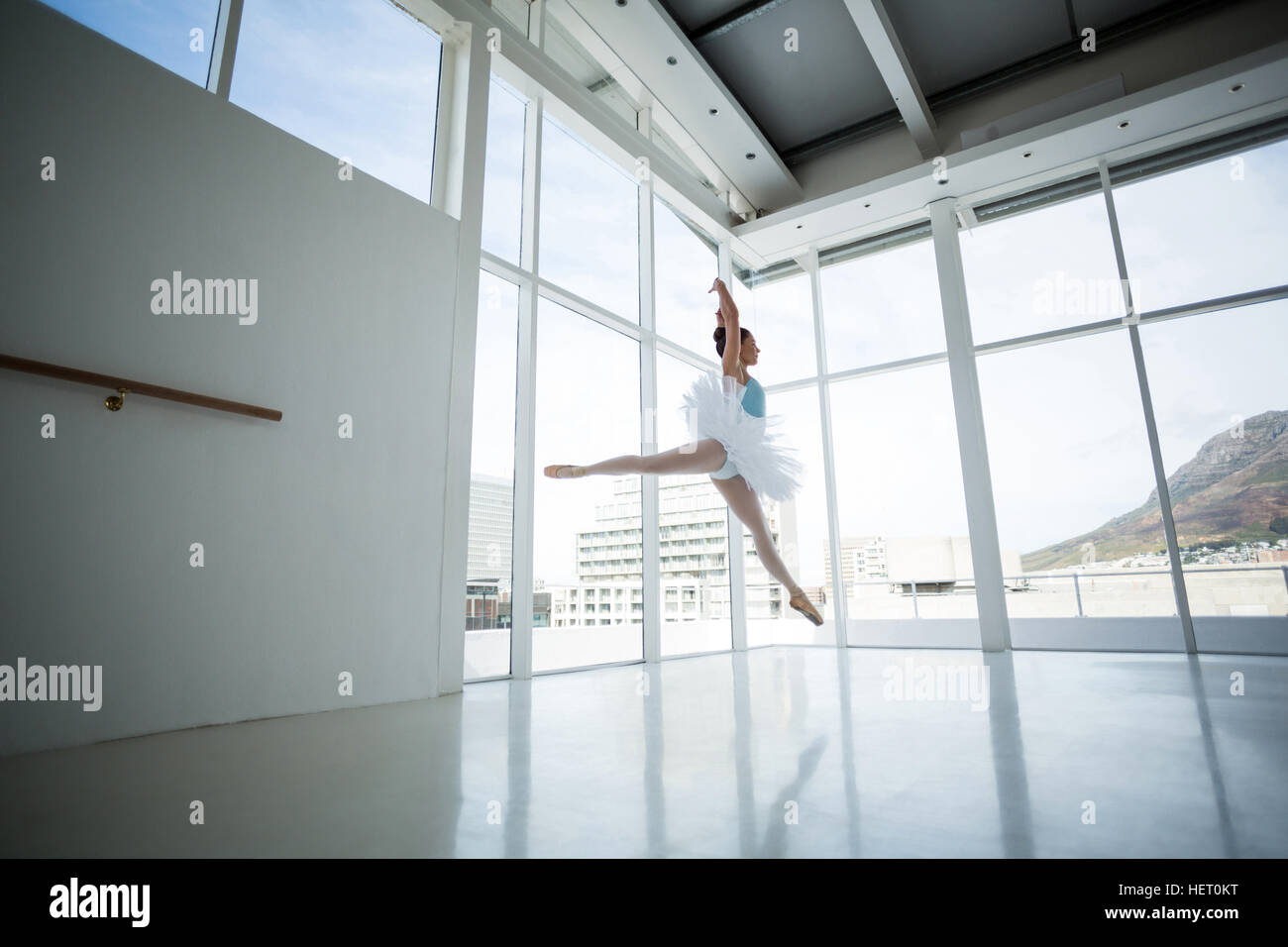 Ballerina practising ballet dance barre hi-res stock photography and ...