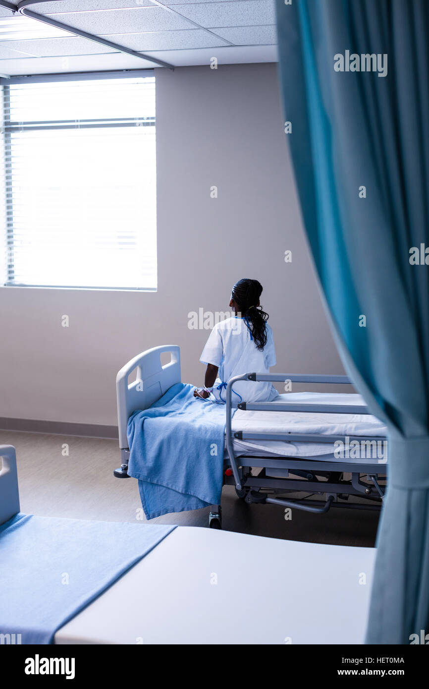 Patient sitting on the bed at hospital Stock Photo - Alamy