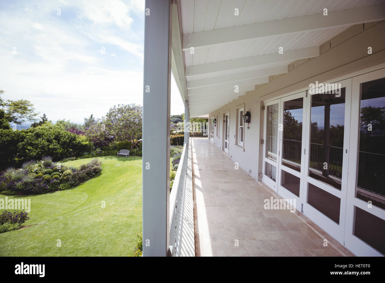 Exterior of a house with empty veranda and lawn Stock Photo - Alamy