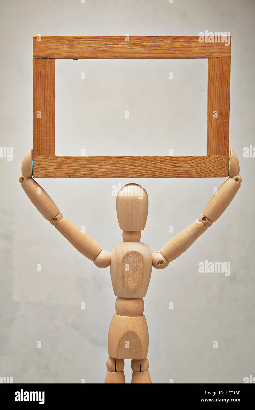 Wooden mannequin with frame Stock Photo - Alamy