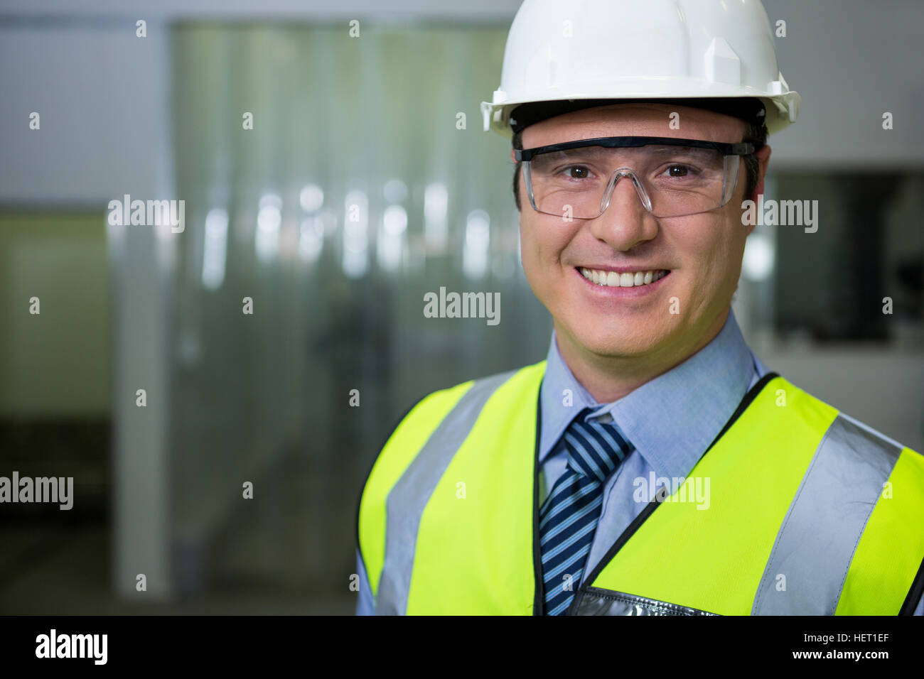 Technician in hard hat and protective eyewear at meat factory Stock ...