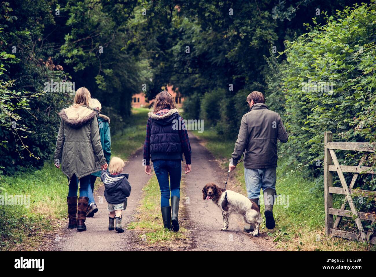 Family Walking Dog Togetherness Nature Concept Stock Photo - Alamy