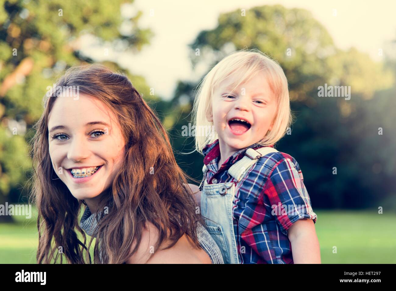 Sister Brother Togetherness Outdoors Piggyback Concept Stock Photo - Alamy