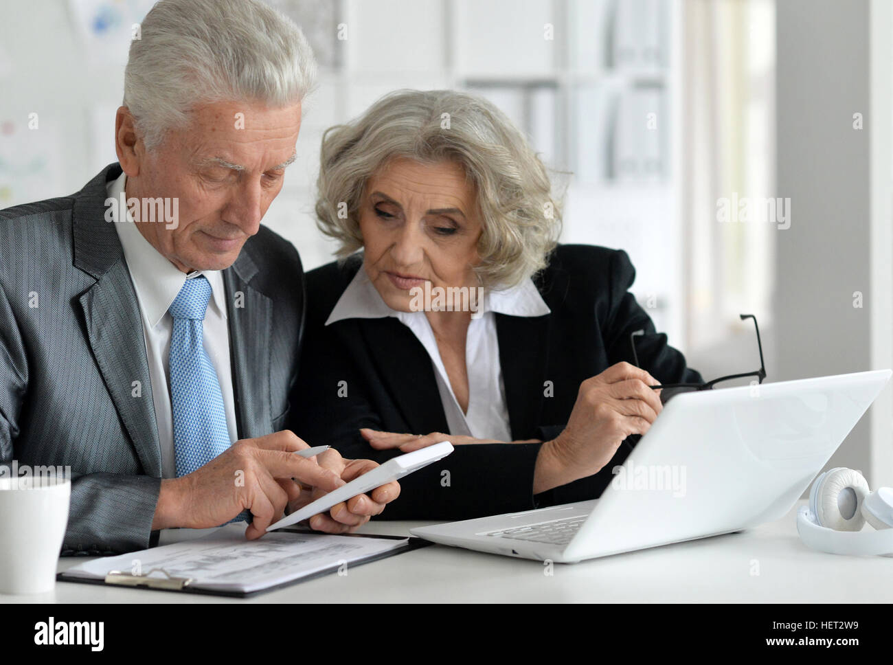 Senior businesspeople working Stock Photo - Alamy