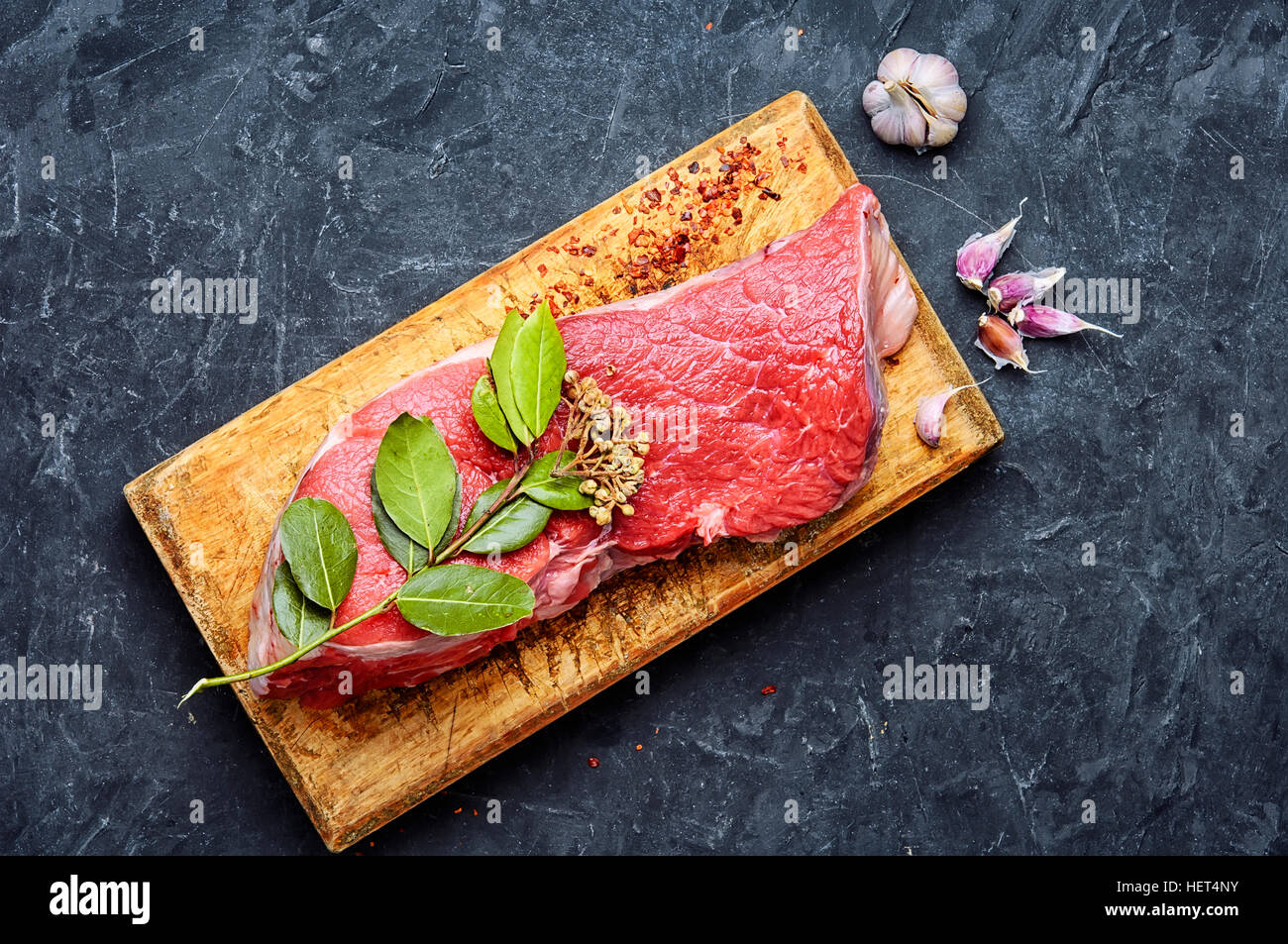 Raw veal meat on kitchen board with spice Stock Photo - Alamy