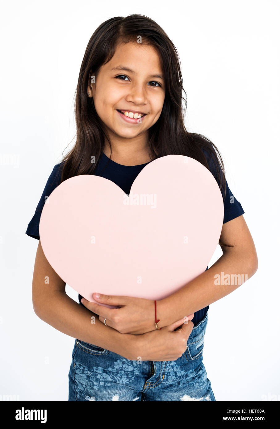Cheerful Little Girl Hugs Heart Concept Stock Photo - Alamy
