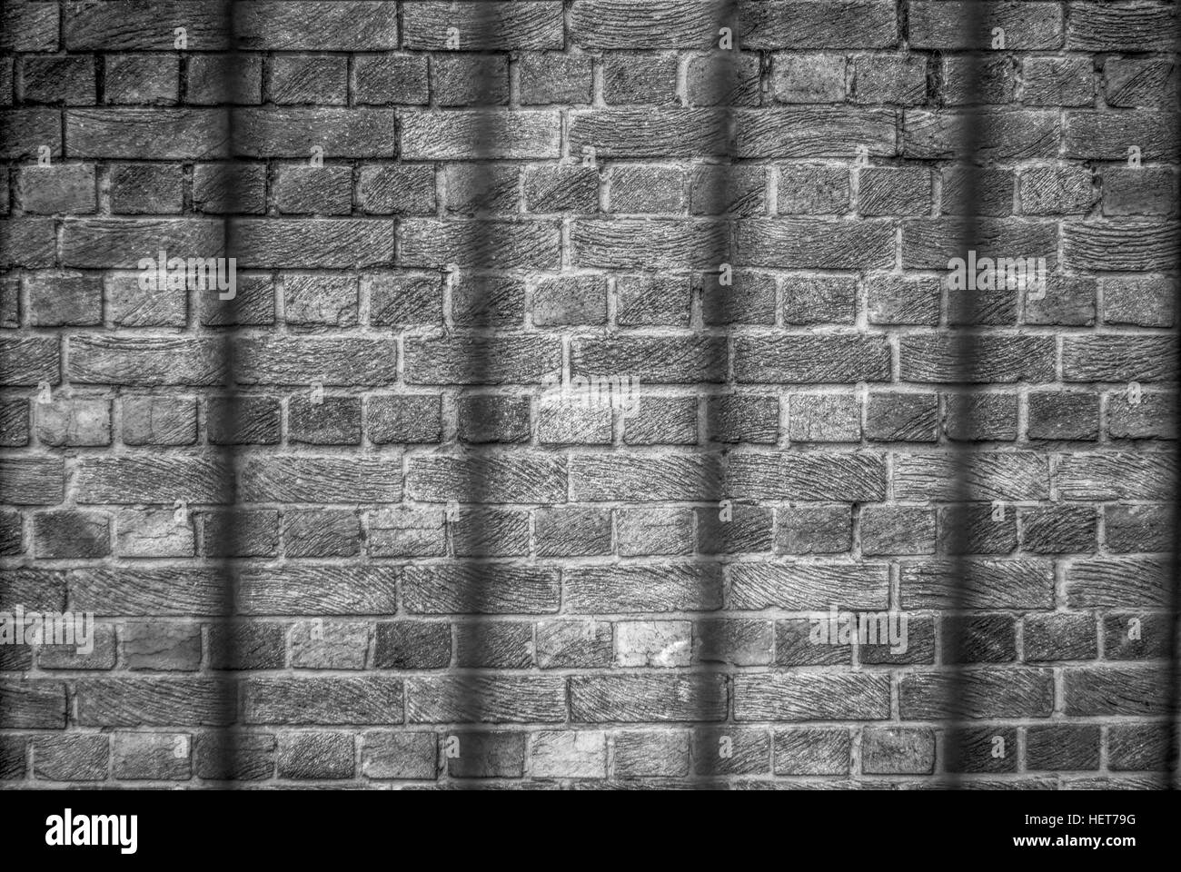 Brick Wall and vertical shadows in black and white Stock Photo - Alamy