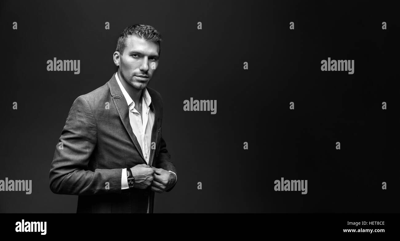 Handsome man holding camera in Black and White Stock Photos & Images ...