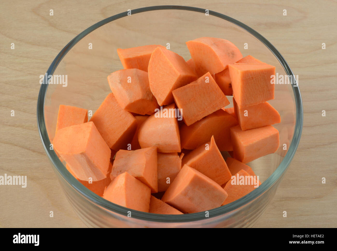 Raw uncooked yam cubes in glass bowl Stock Photo - Alamy
