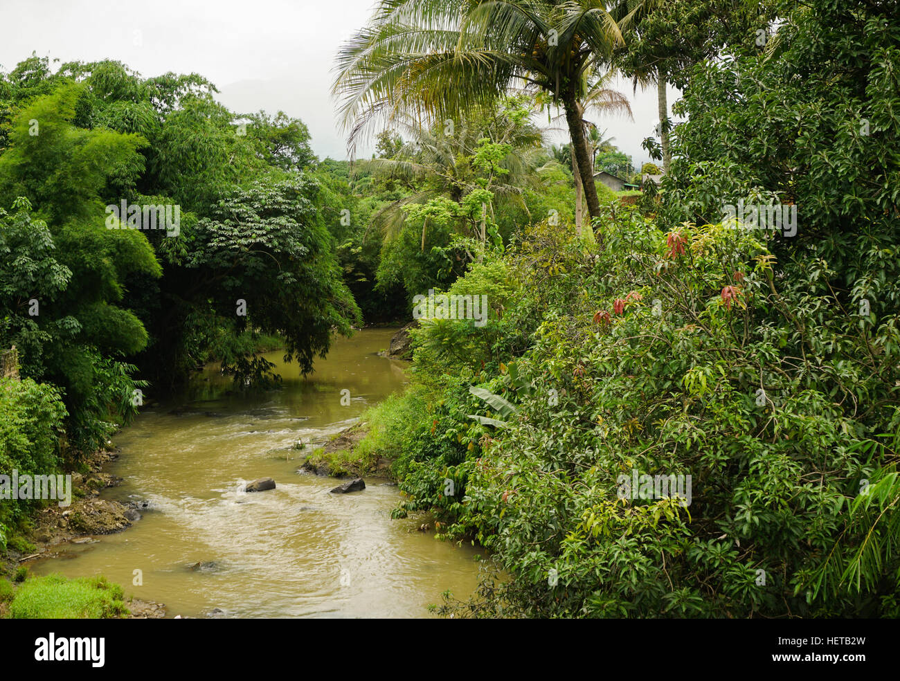 dirty river flow photo taken in Bogor Indonesia Stock Photo - Alamy