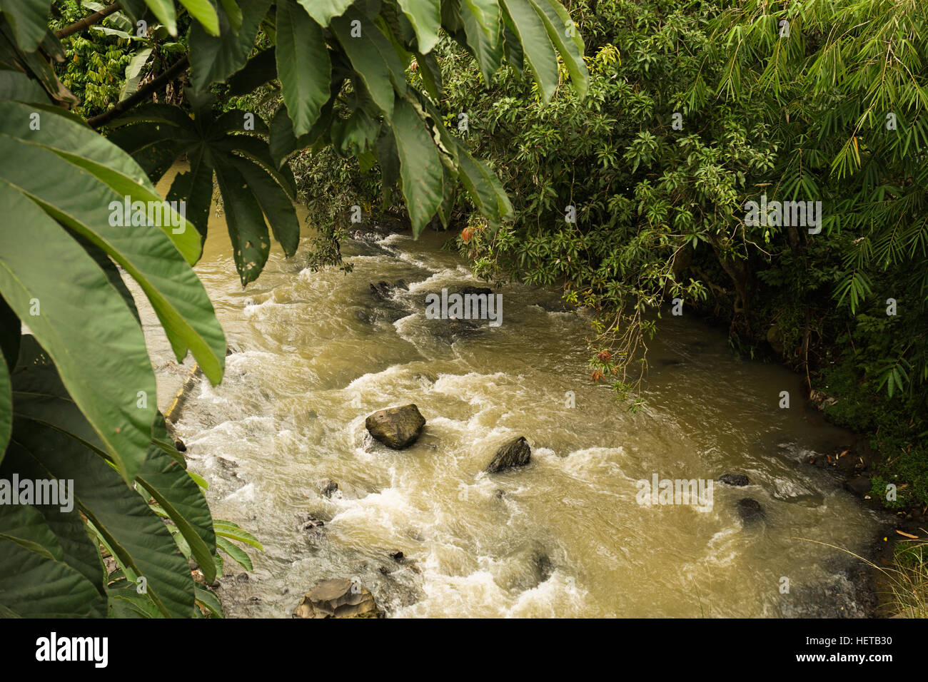 dirty river flow photo taken in Bogor Indonesia Stock Photo - Alamy