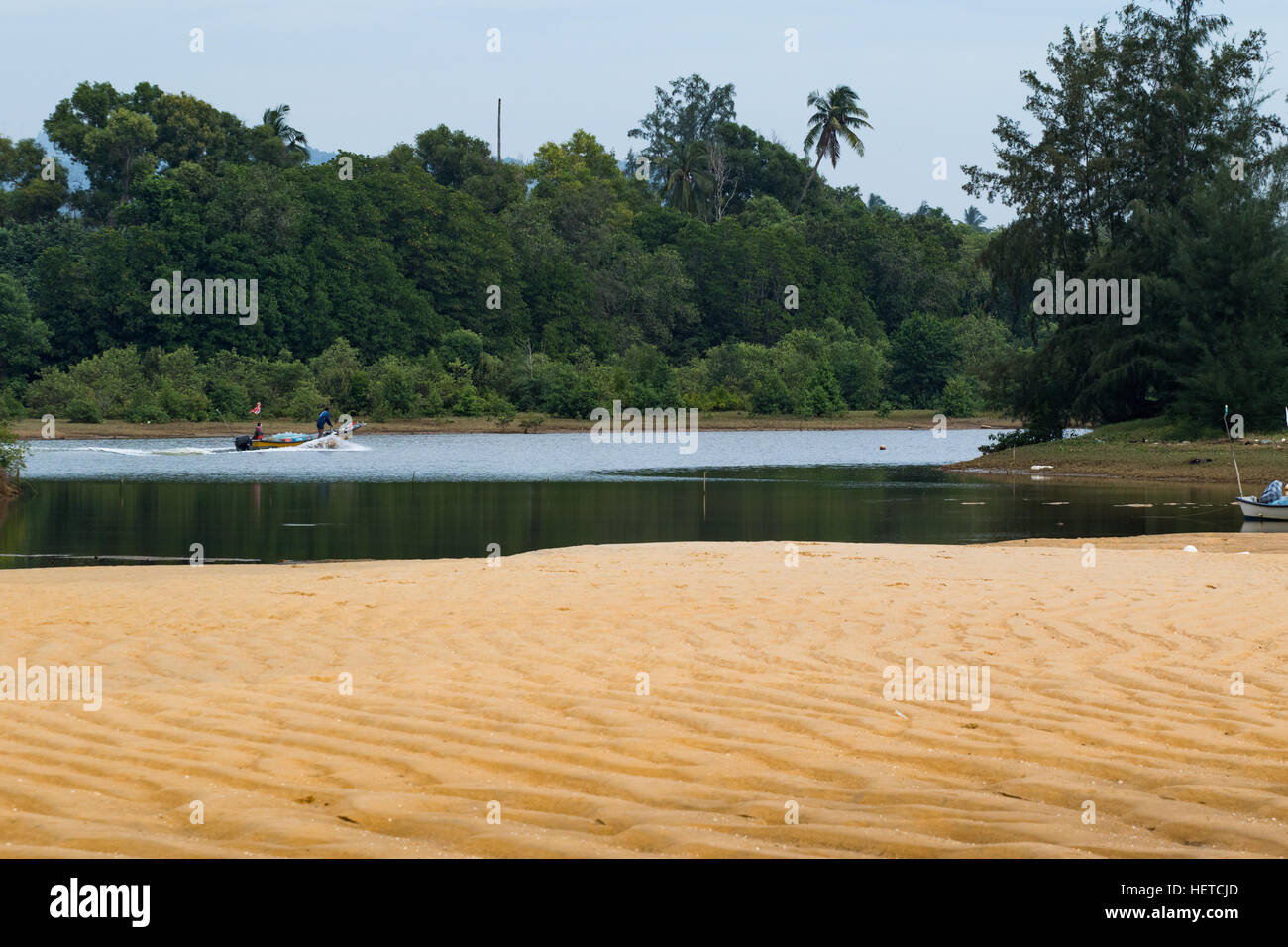 Fishing boat heading for the sea Stock Photo - Alamy