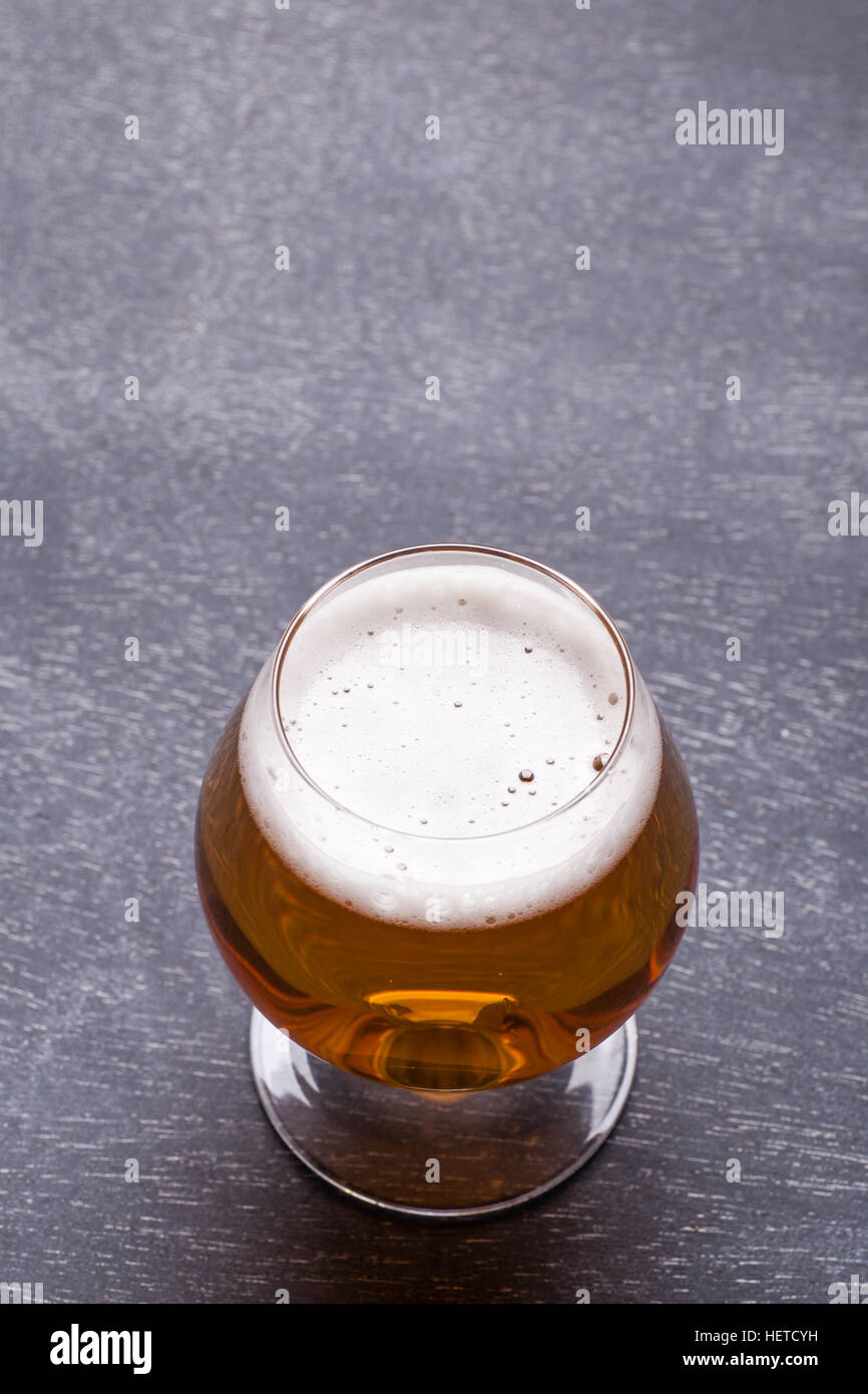 Small snifter glass with strong beer on a classic blackboard Stock ...