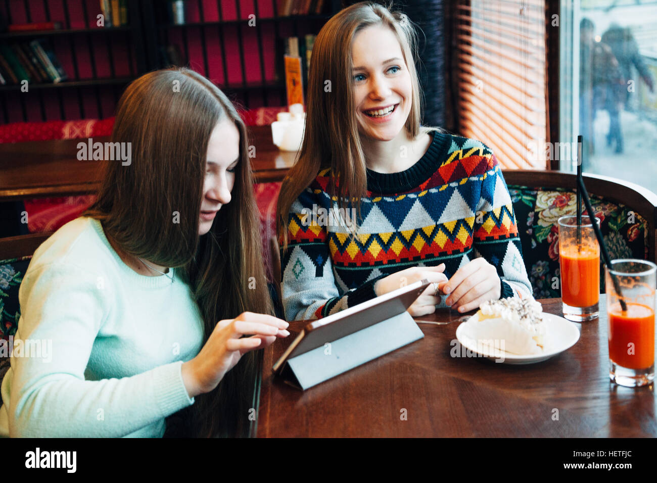 Selfie girls in cafe Stock Photo - Alamy
