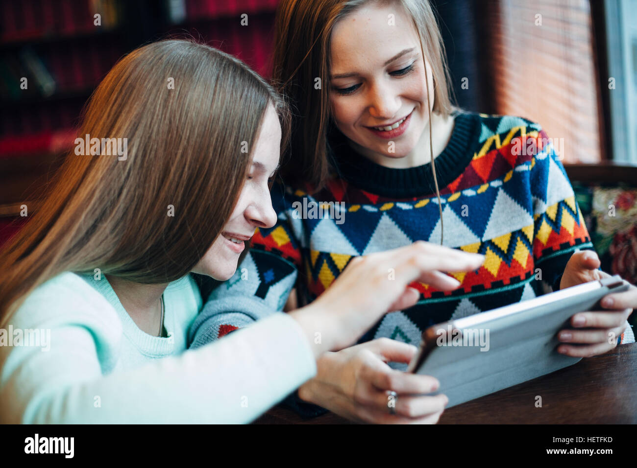 Girl friends communicate in a cafe Stock Photo - Alamy