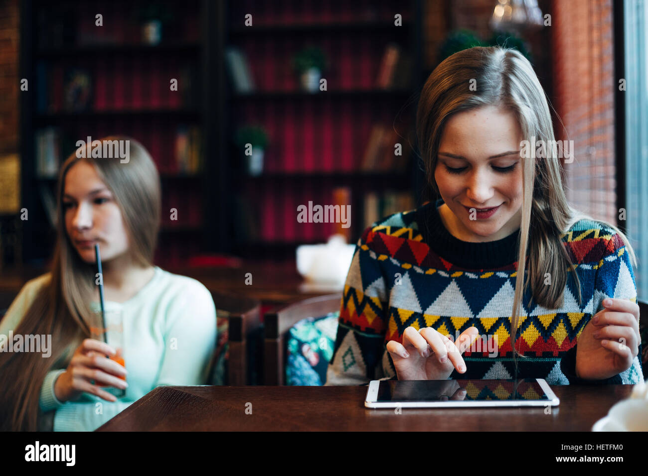 Girl friends communicate in a cafe Stock Photo - Alamy