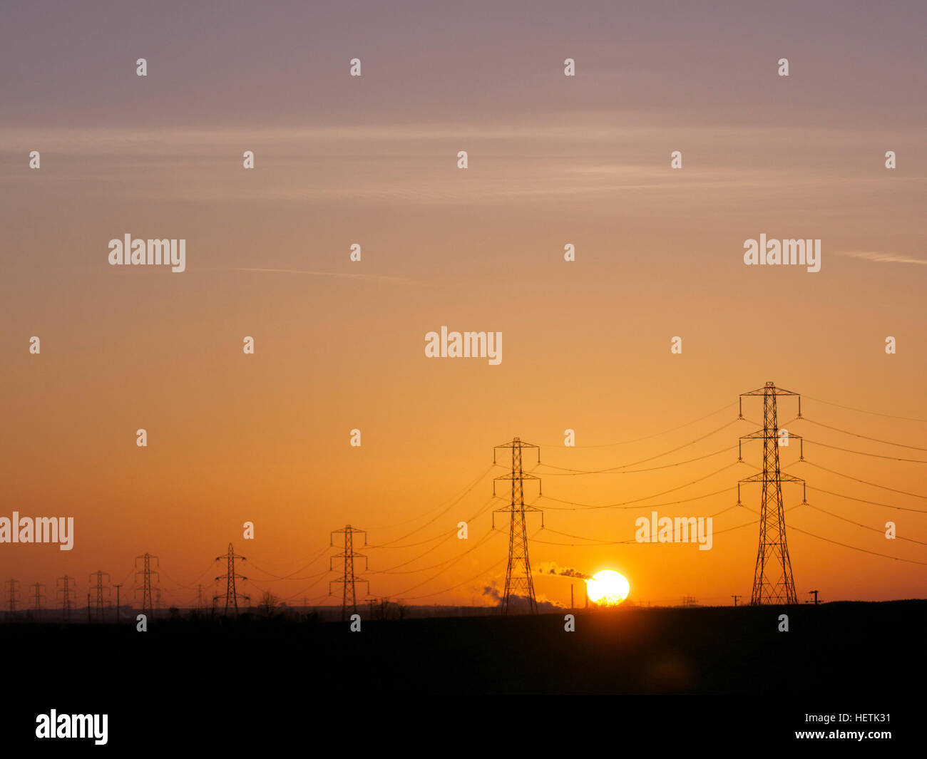 Electricity pylons at sunset, Kent Stock Photo - Alamy