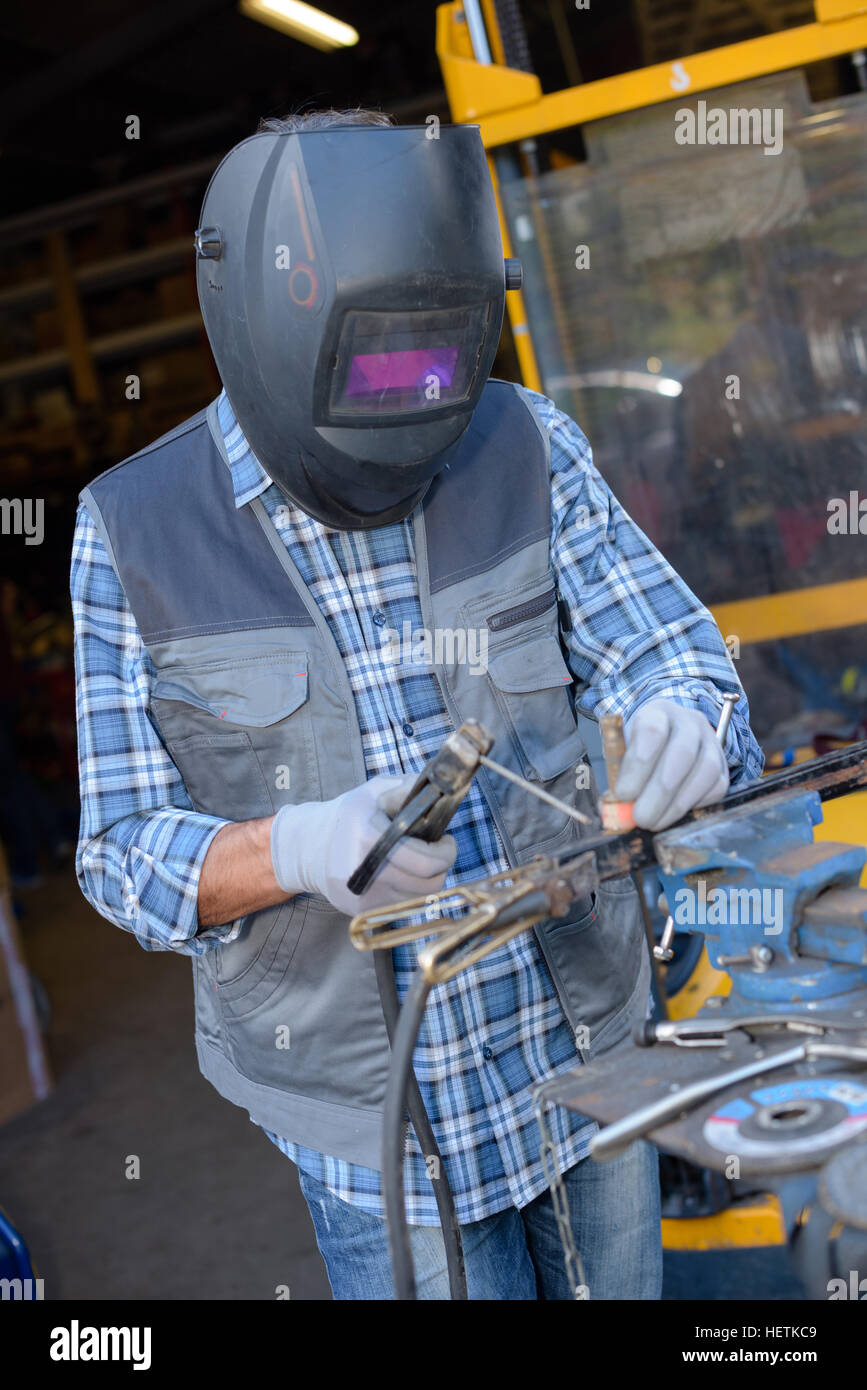 Man using welder Stock Photo - Alamy