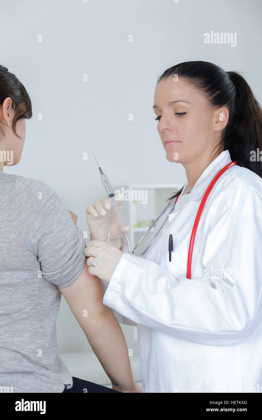 doctor injecting patients hand Stock Photo - Alamy