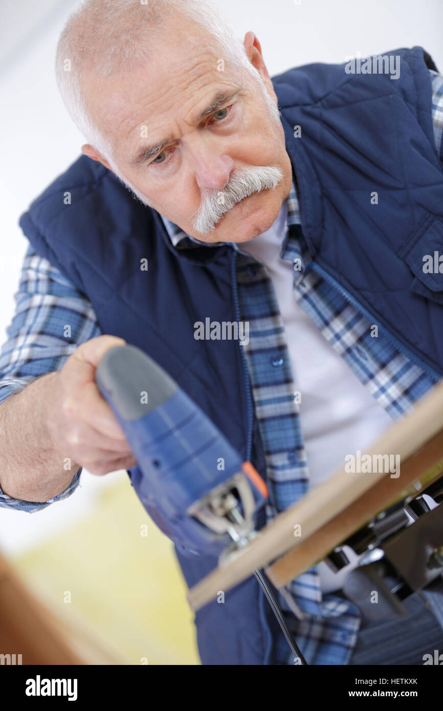 Manual jigsaw hi-res stock photography and images - Alamy