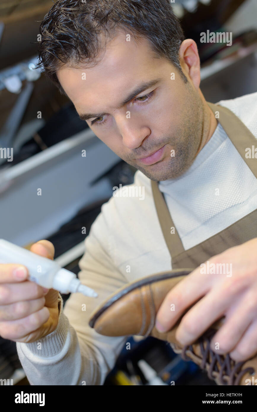 Cobbler at work Stock Photo - Alamy