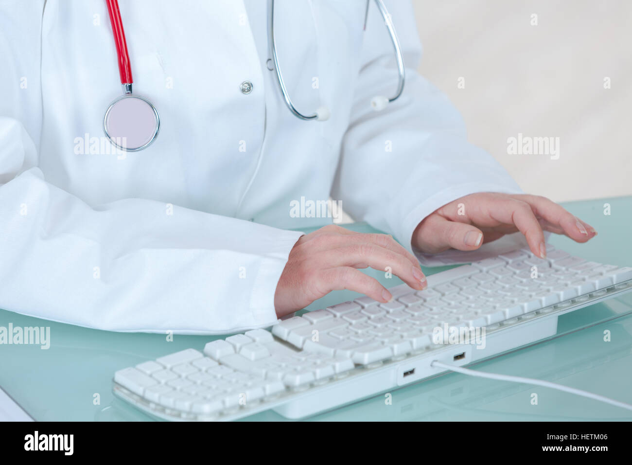 Beautiful smiling doctor typing hi-res stock photography and images - Alamy