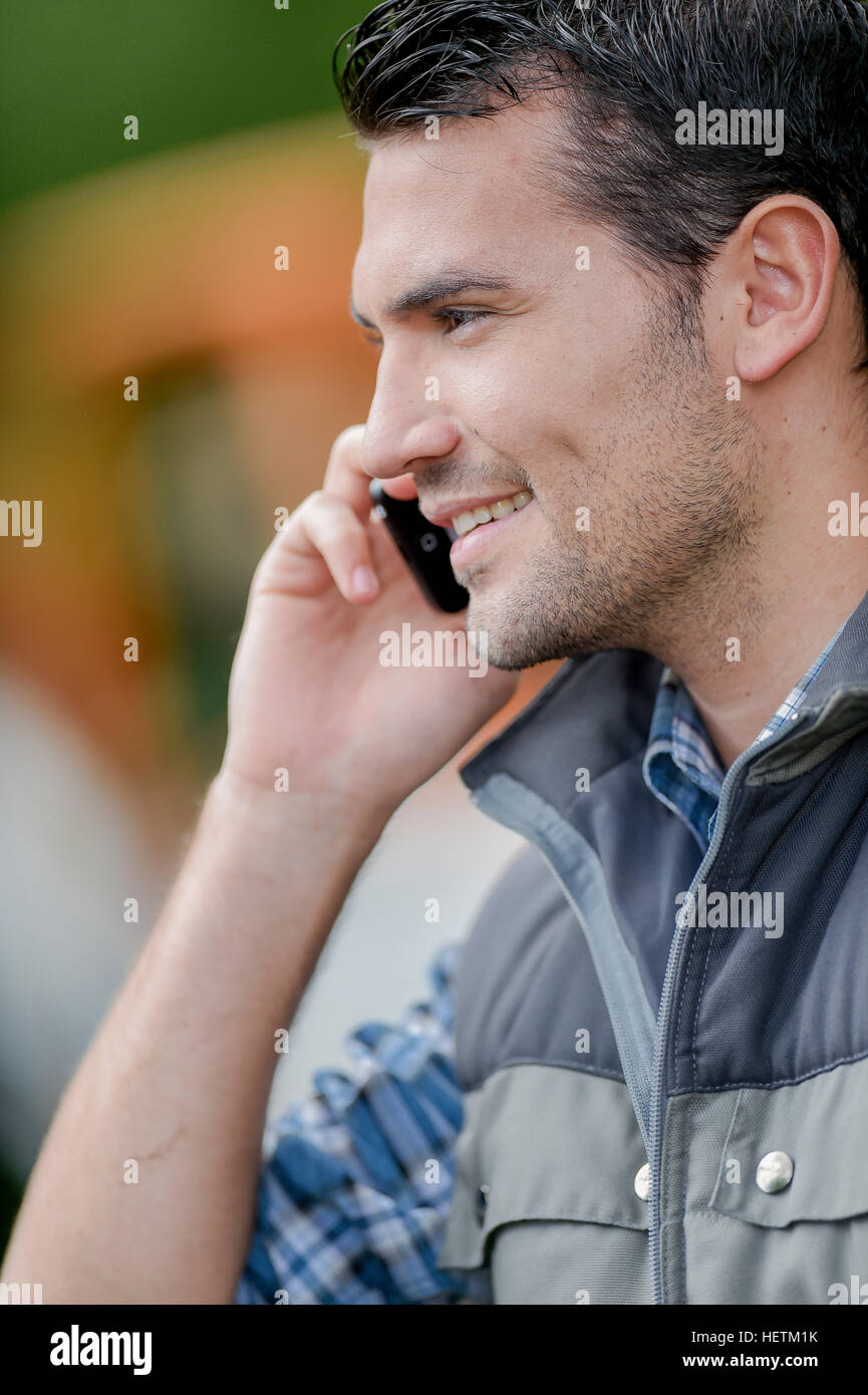 Foreman taking a call Stock Photo - Alamy