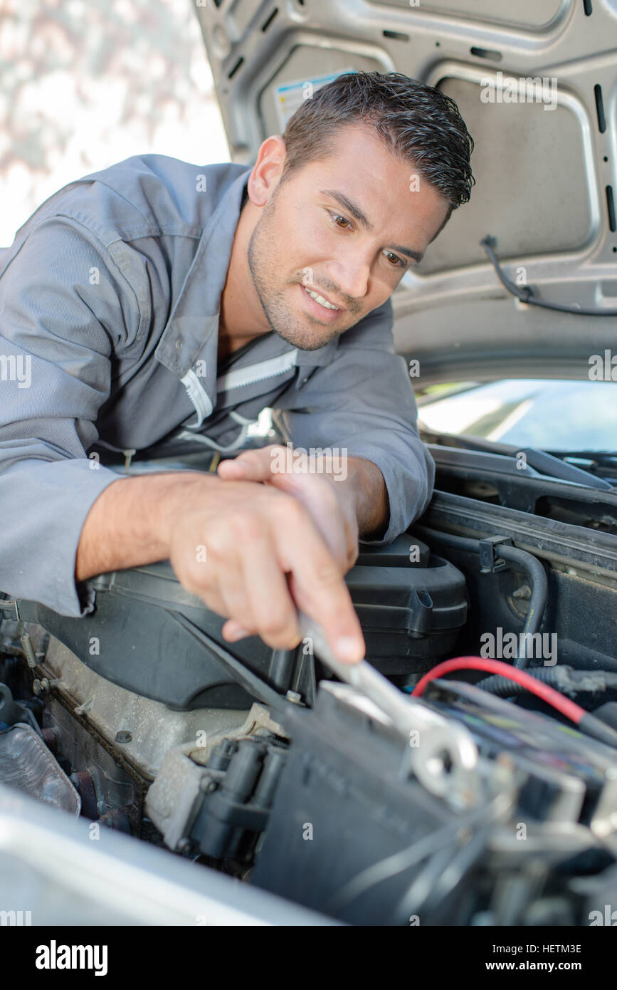man fixing an engine Stock Photo - Alamy