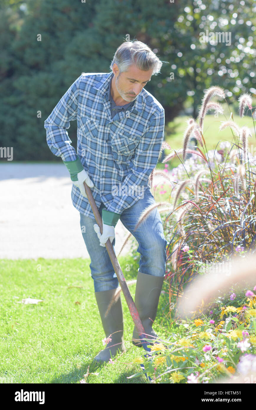 Man digging flowers hi-res stock photography and images - Alamy