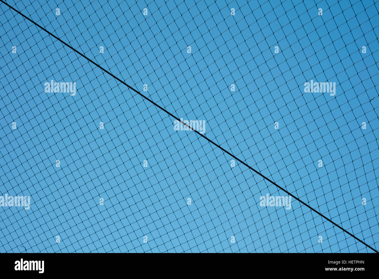Net with blue sky background Stock Photo - Alamy