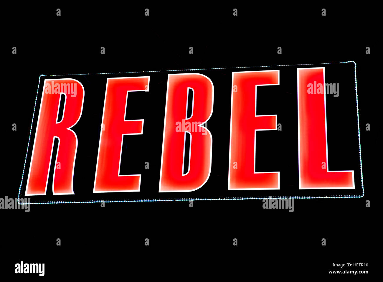 The word REBEL illuminated in lights Stock Photo - Alamy
